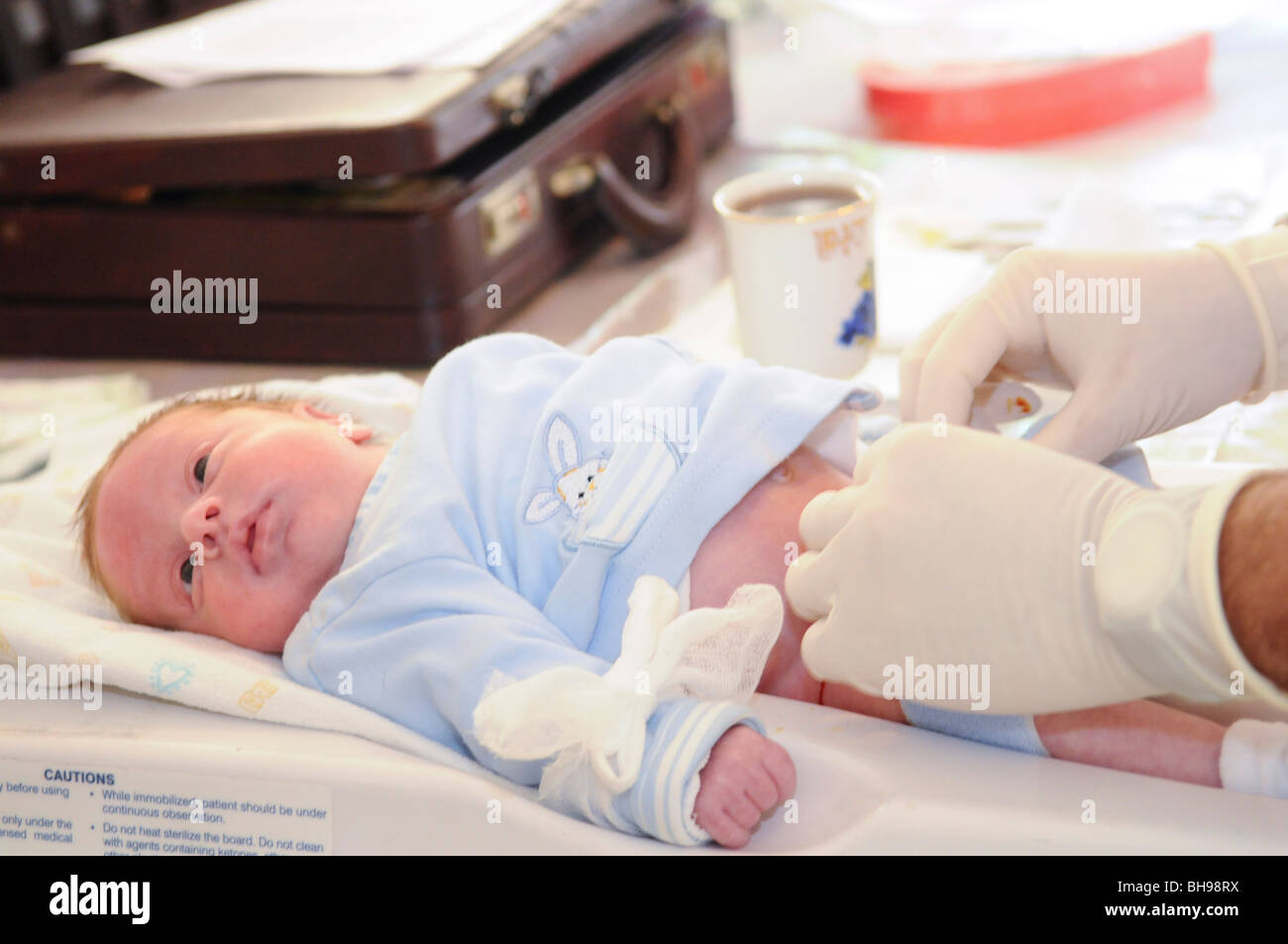 Circumcision - Brit Mila Ceremony The Mohel performs the rite Stock ...
