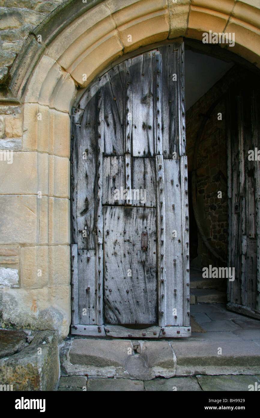 Detail of an ancient oak studded door within a door at Haddon Hall in ...