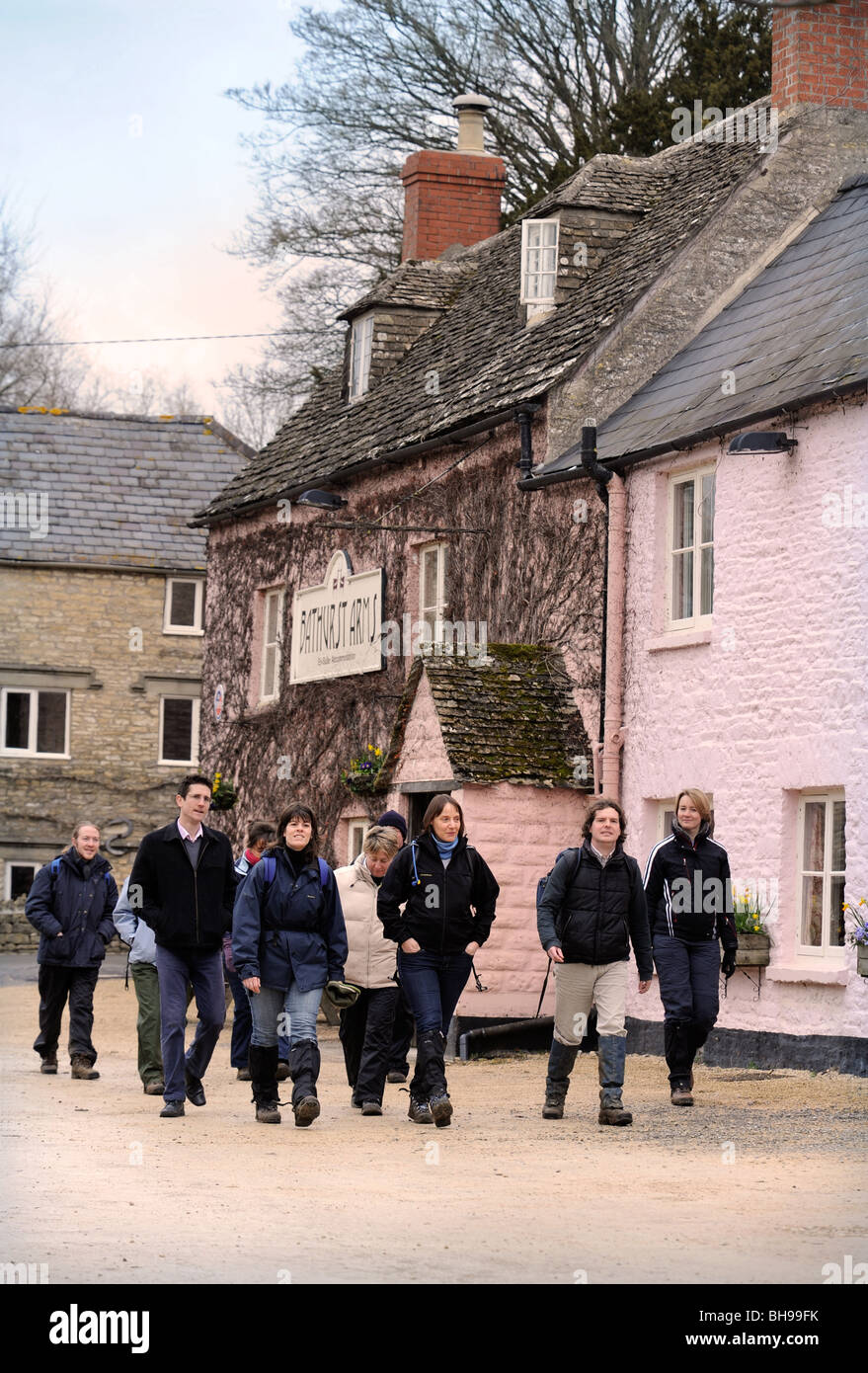 A small group on a walking holiday in the Cotswolds pictured leaving ...
