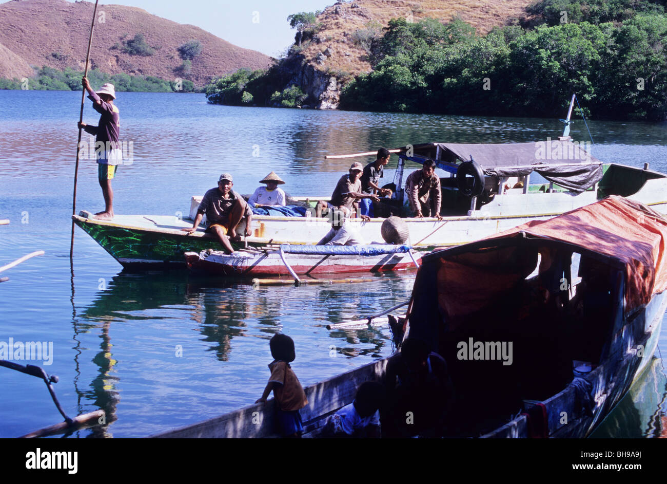 Komodo Islands fishermen, moor up to the jetty on Rinca Island. Komodo ...