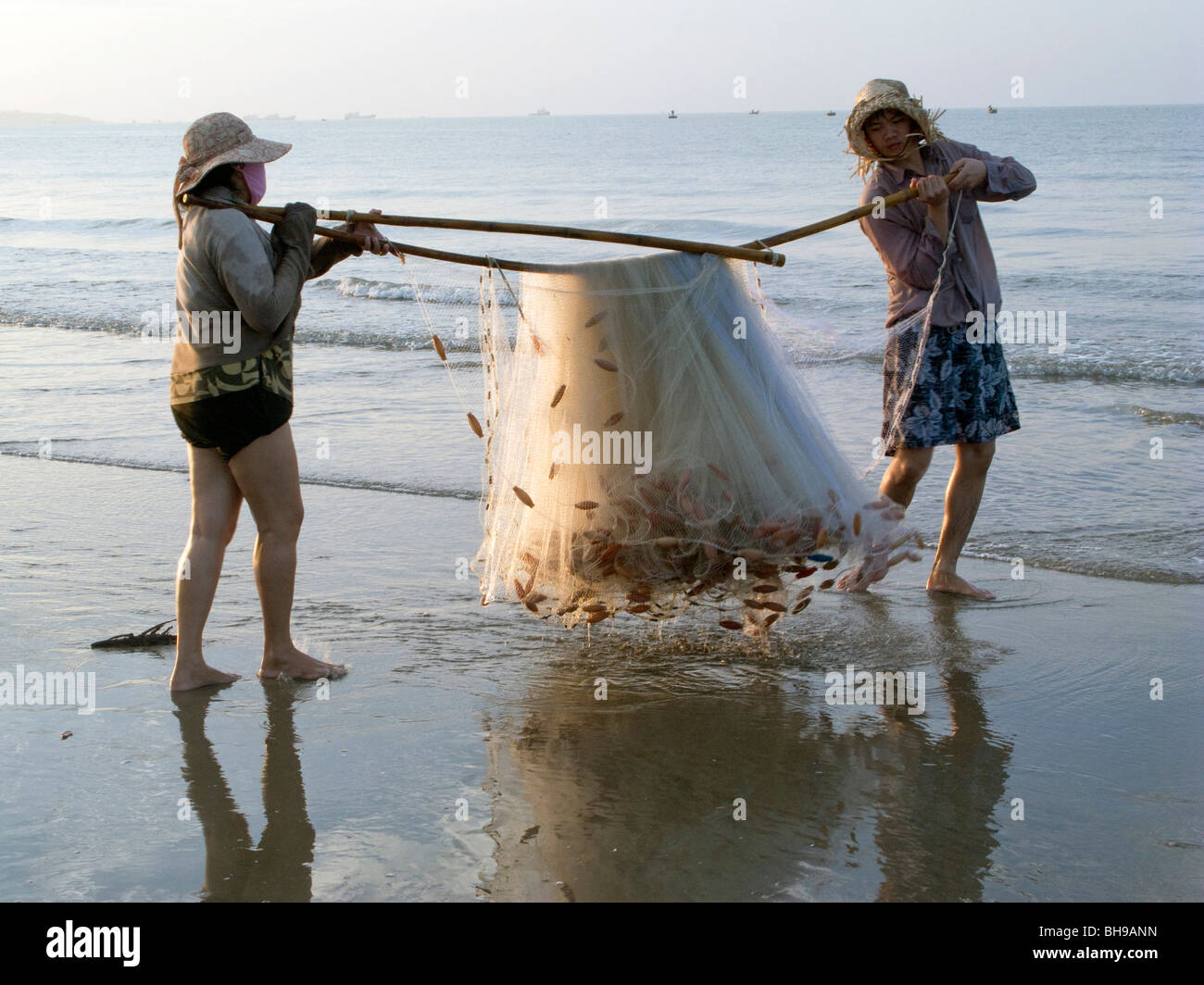 Woman casting net hi-res stock photography and images - Alamy