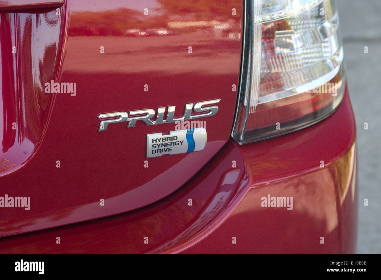 Prius badge on rear of red Toyota Prius Stock Photo - Alamy