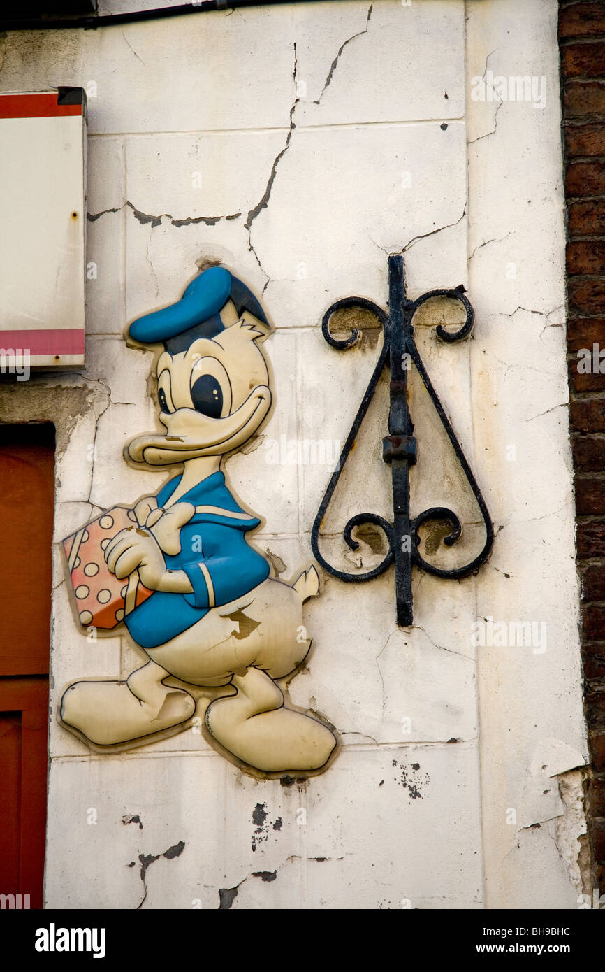 Donald Duck; old shop sign Stock Photo - Alamy