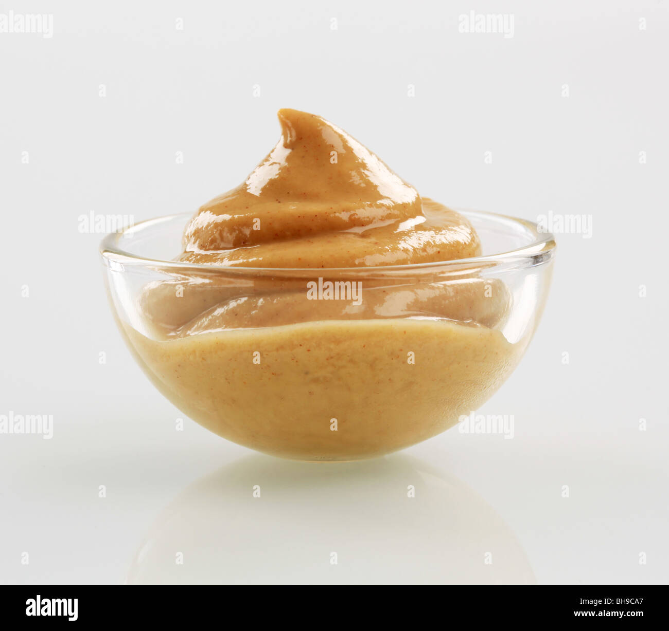 Swirl of spicy mustard in a bowl Stock Photo - Alamy