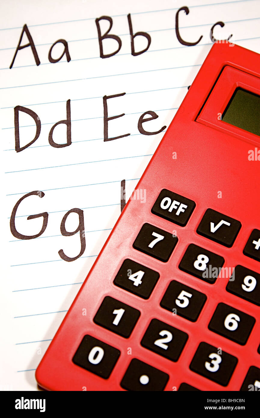 Students desktop lesson plan and calculator Stock Photo - Alamy