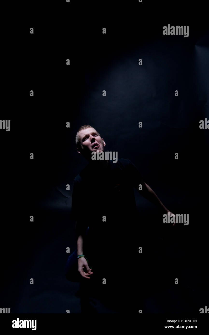 Man in photographic studio pulling facial expression Stock Photo - Alamy