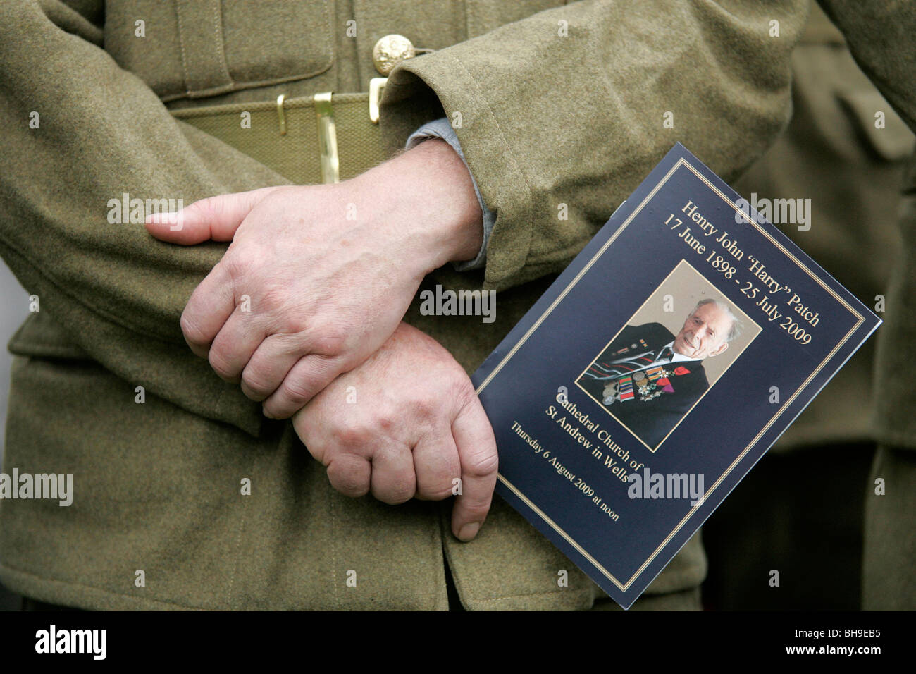 A mourner holds the memorial leaflet at the funeral of Harry Patch who ...