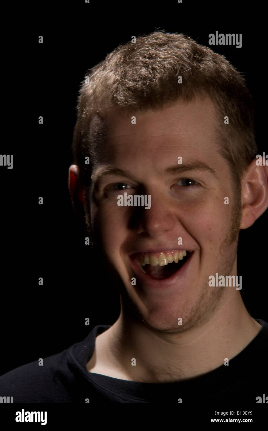 Man in photographic studio pulling facial expression Stock Photo - Alamy
