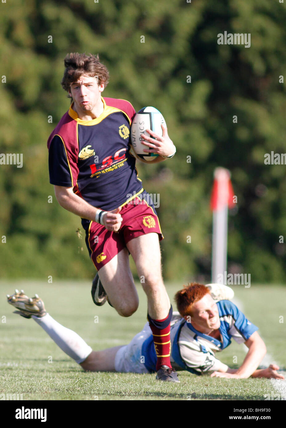 An attacking player breaking away evades the tackle of his opponent ...