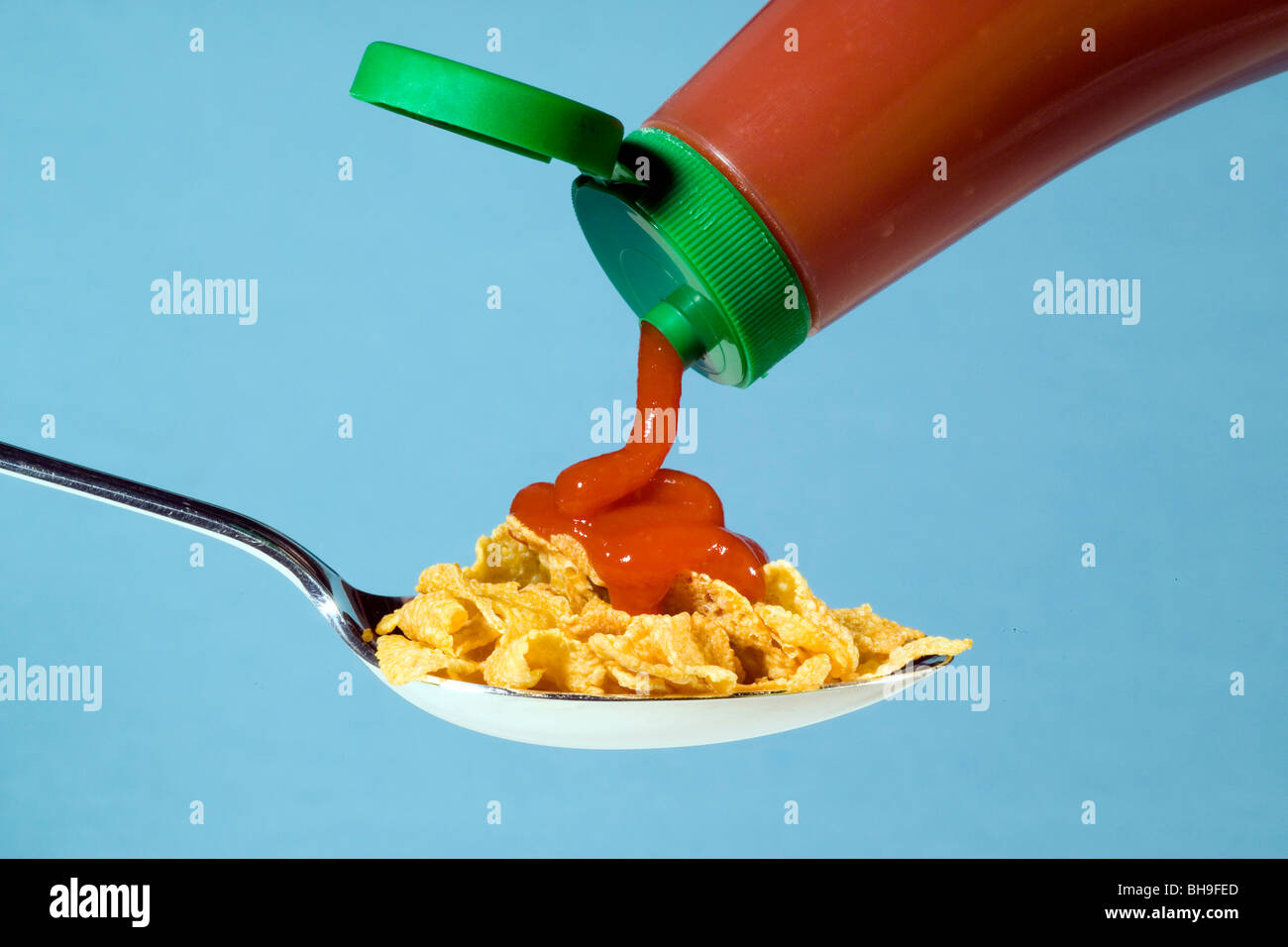 Tomato ketchup on cornflakes on a spoon Stock Photo - Alamy