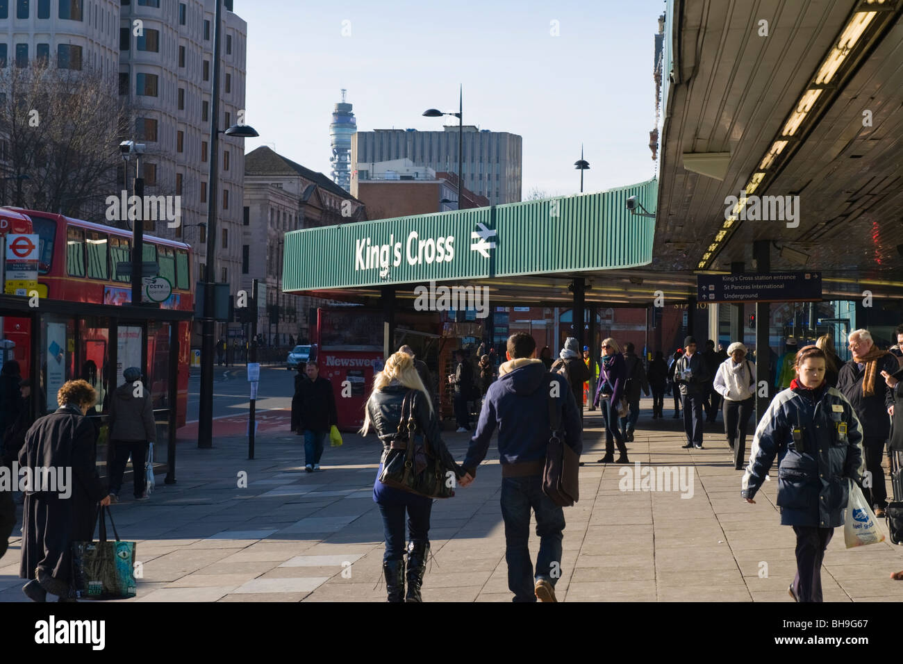 King's Cross Station & Euston Road with pedestrians , young couple ...