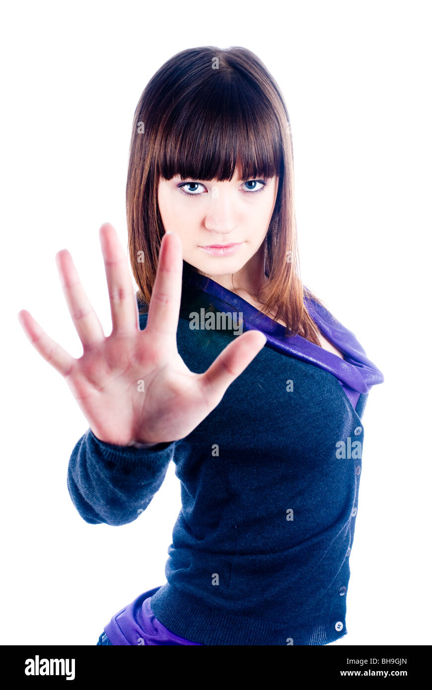 Woman showing stop sign on isolated background Stock Photo - Alamy