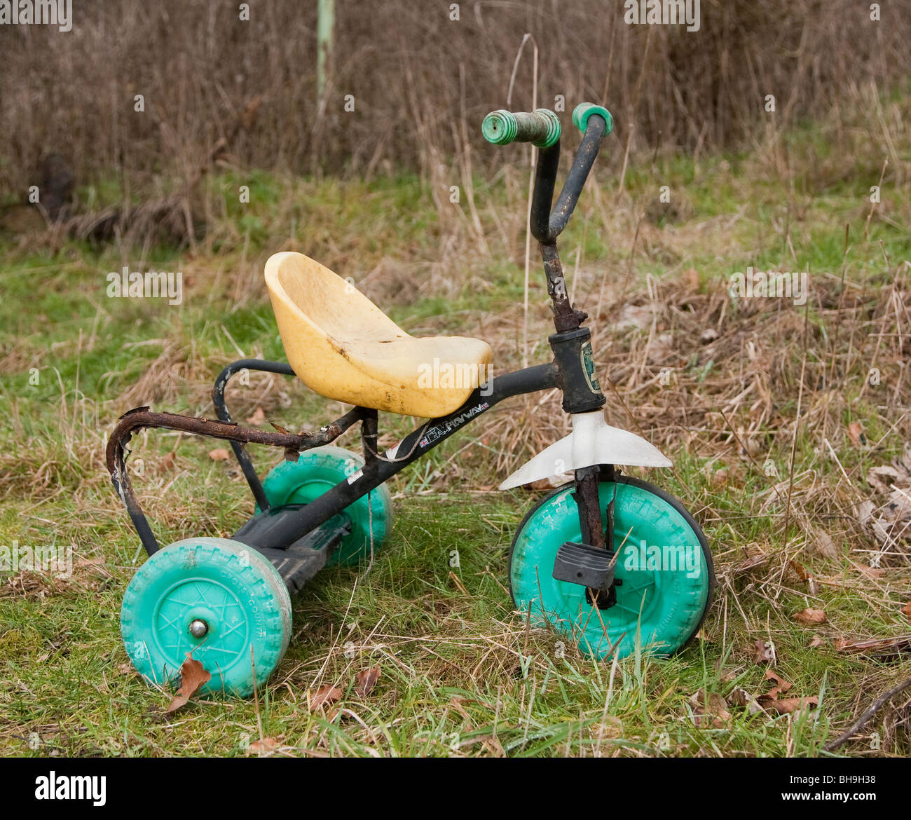 Abandoned Tricycle on Waste Land Stock Photo - Alamy