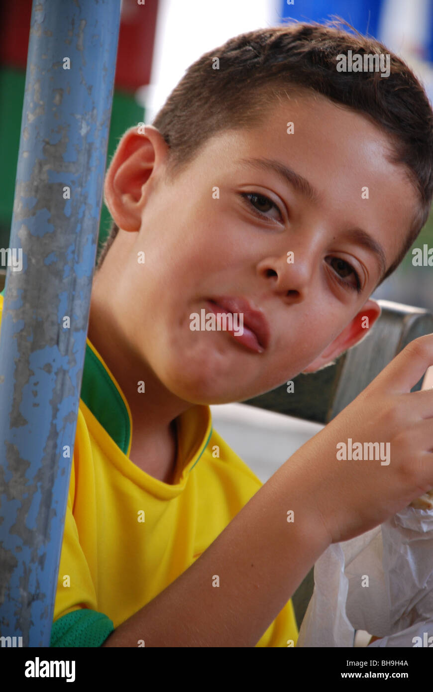 boy eating looking at the camera Stock Photo - Alamy
