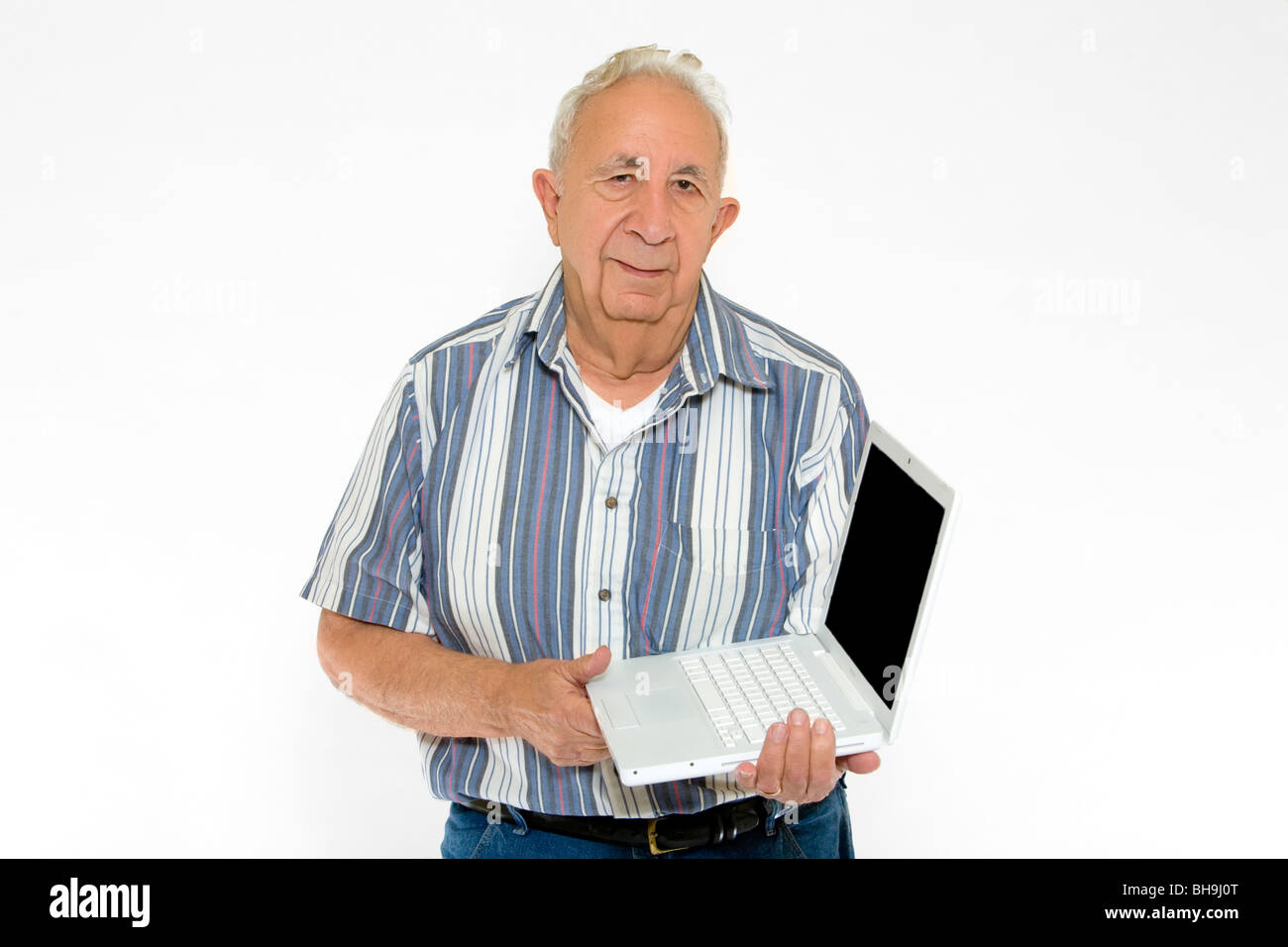 A senior retired elderly gentleman holds a computer Stock Photo - Alamy