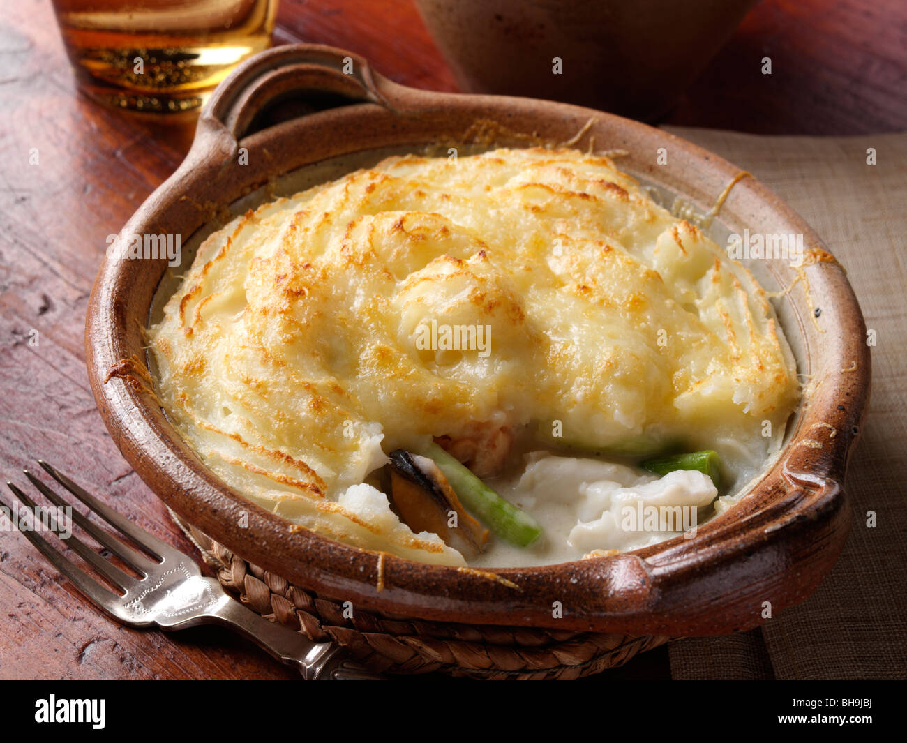 Individual fish pie seafood main meals Stock Photo - Alamy
