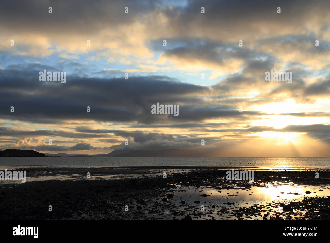 Sunset over the Isle of Skye from Applecross Bay Stock Photo - Alamy