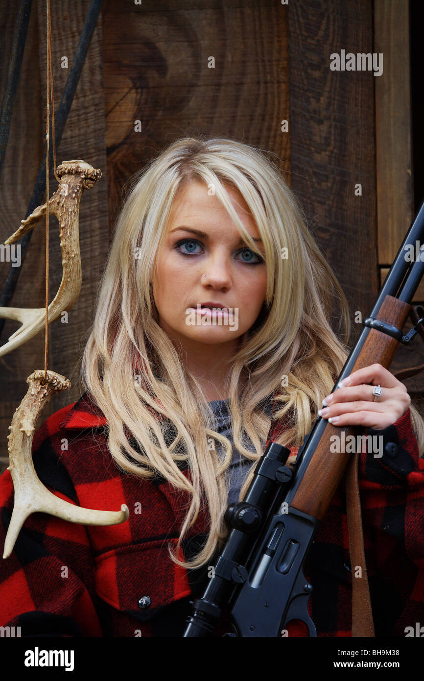 YOUNG WOMAN 21 Y.O. FEMALE HUNTER HOLDING MARLIN 30-30 CALIBER RIFLE IN ...