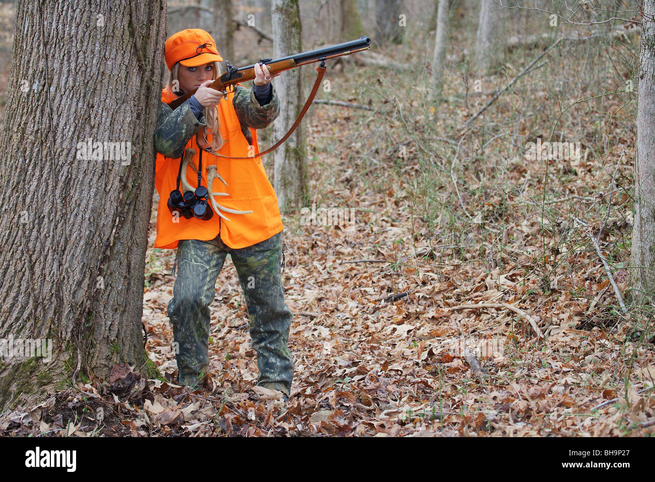 YOUNG WOMAN 21 Y.O. FEMALE HUNTER WALKING IN FOREST LOOKING FOR AND ...