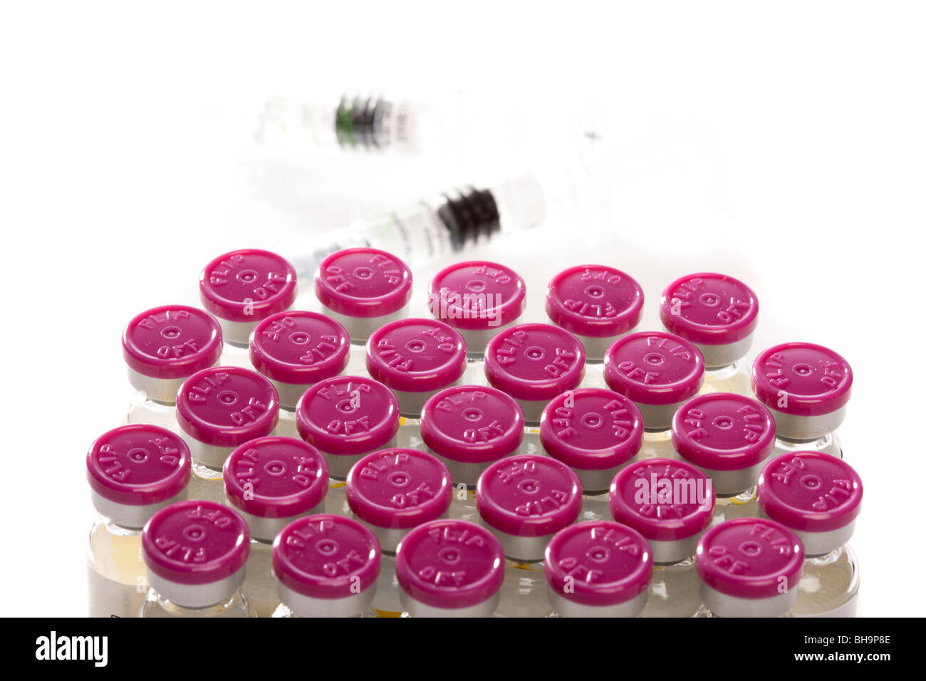 Colorful vials on white background Stock Photo - Alamy