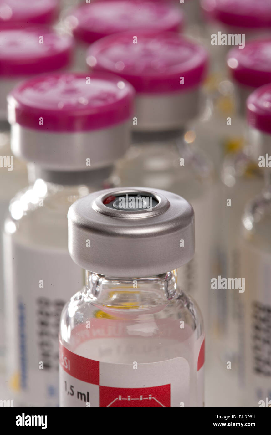 Colorful vials on white background Stock Photo - Alamy