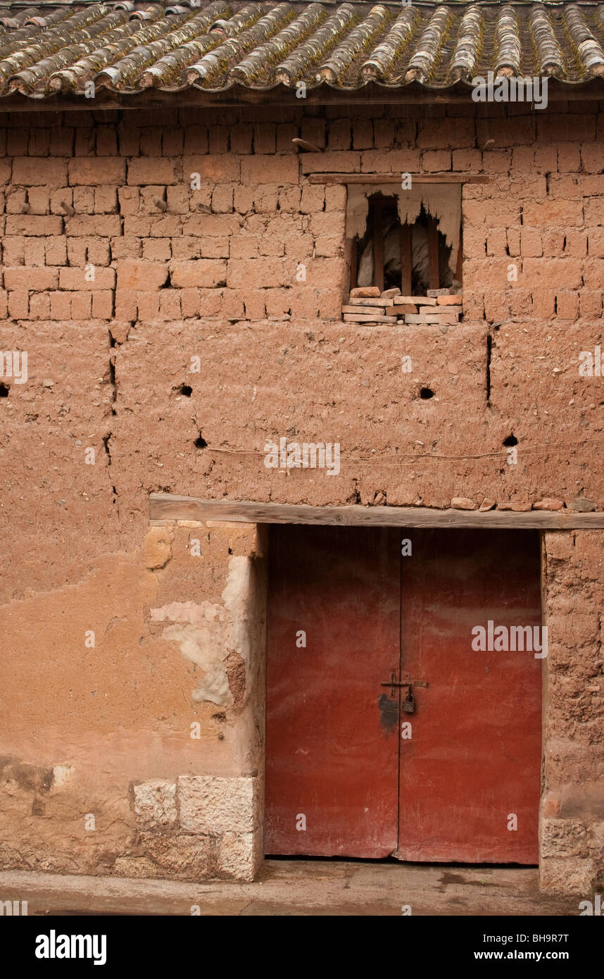 Traditional clay walls making up part of an old building in Yunnan ...