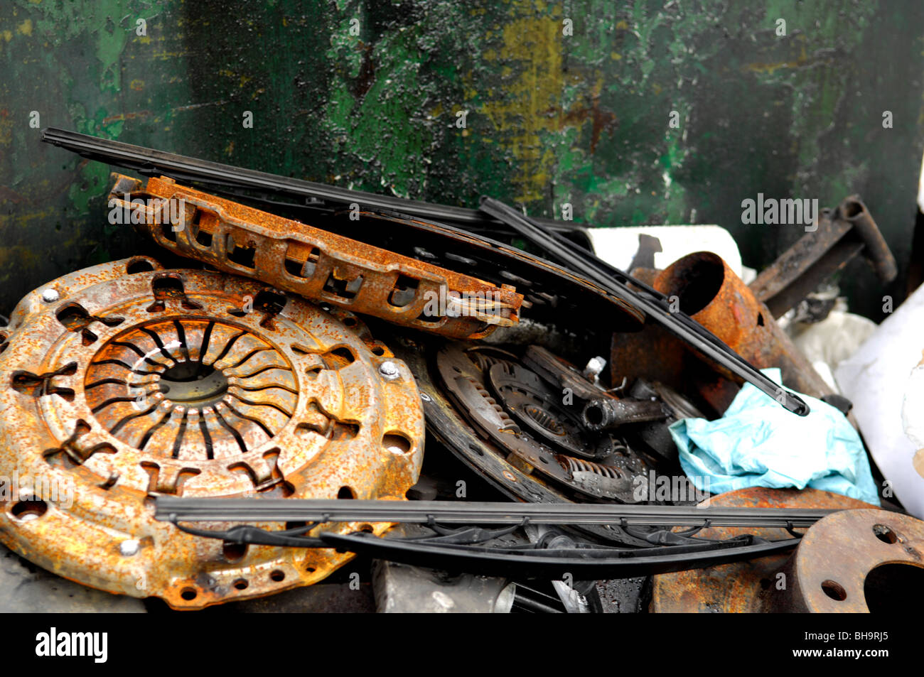 Rusty car parts dumped Stock Photo - Alamy