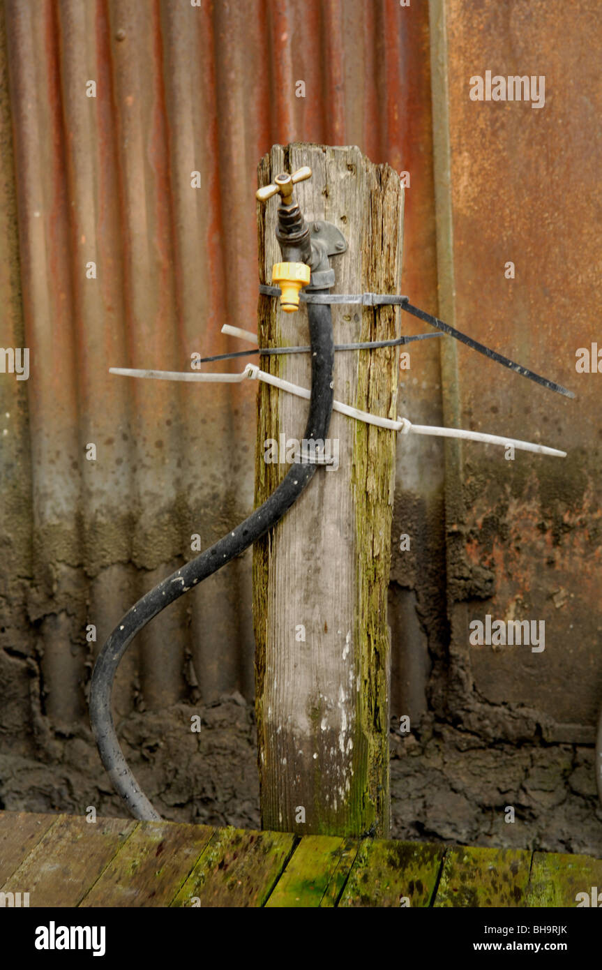 Wooden post with tap hi-res stock photography and images - Alamy