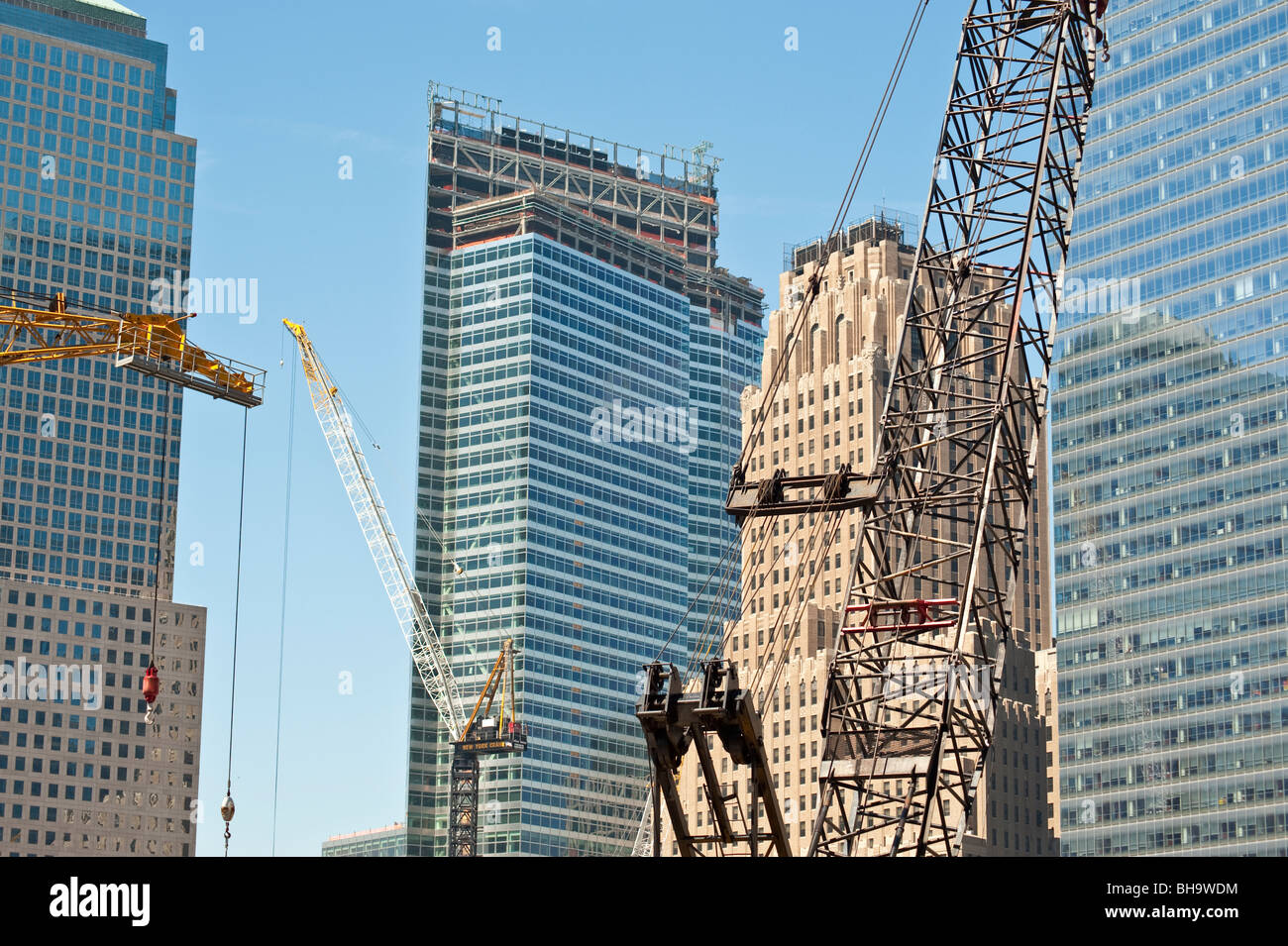 Construction cranes at work putting up high rise buildings Stock Photo ...