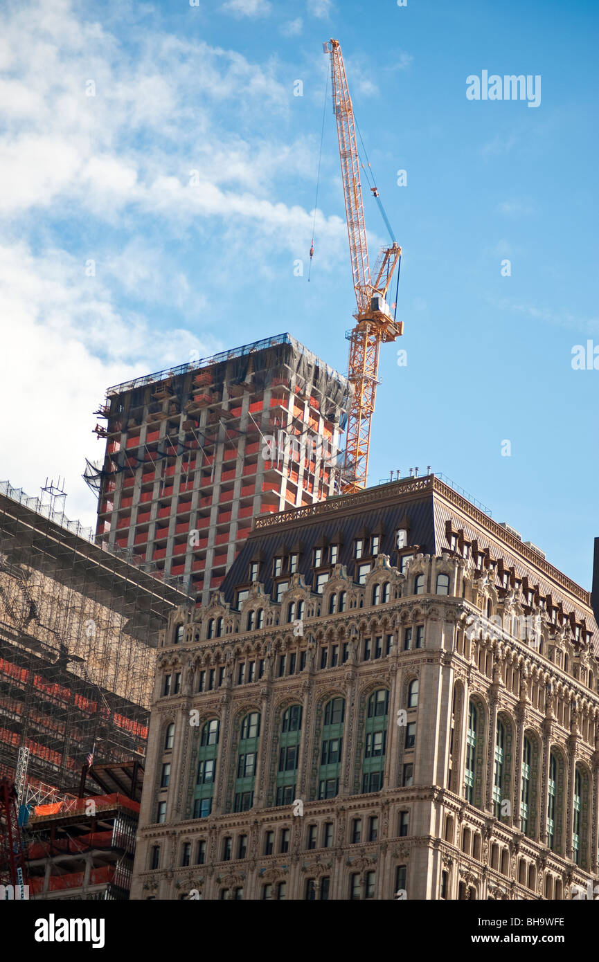 Construction cranes at work putting up high rise buildings Stock Photo ...