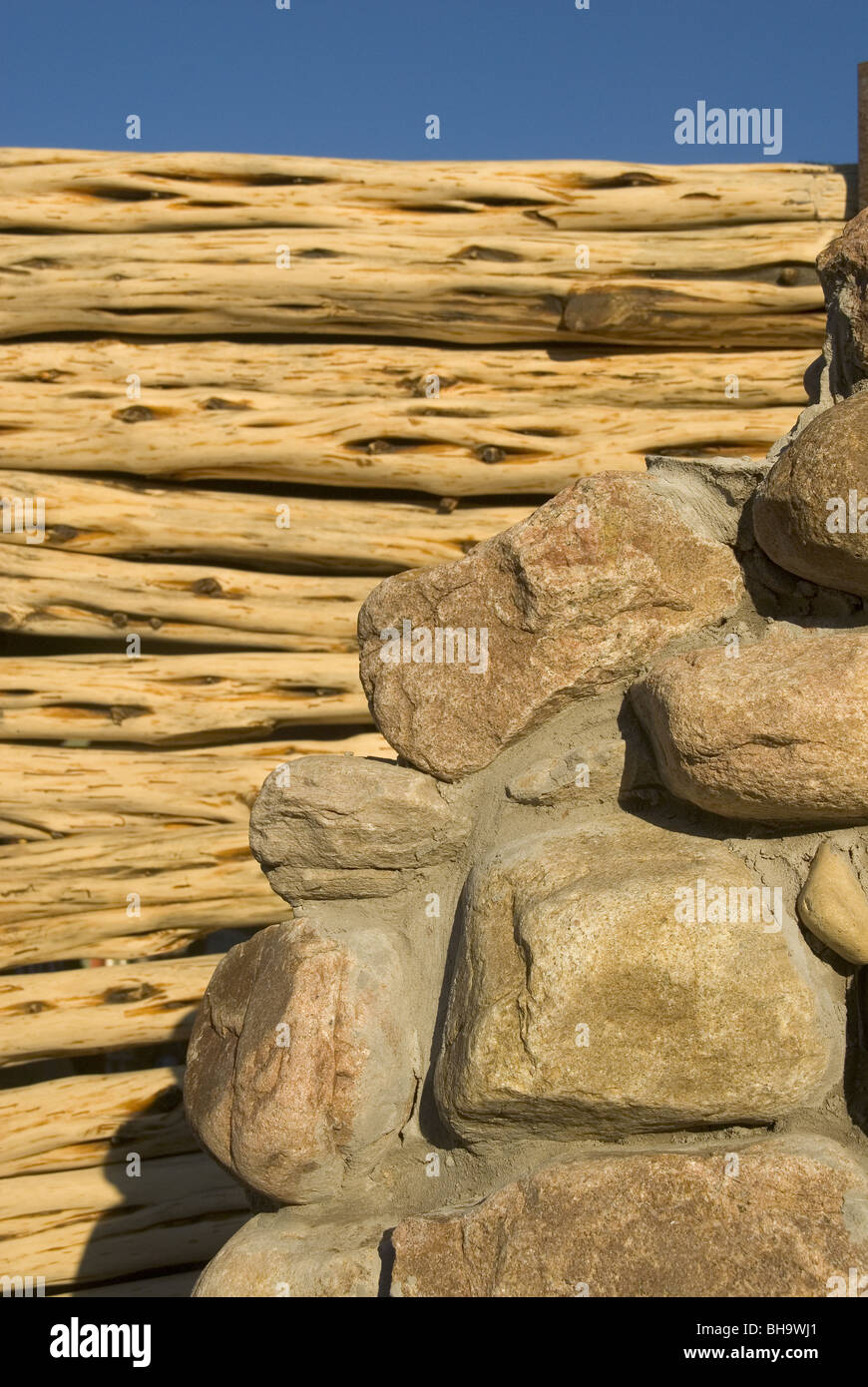 Rock Stone and Cedar Post Wall Stock Photo - Alamy
