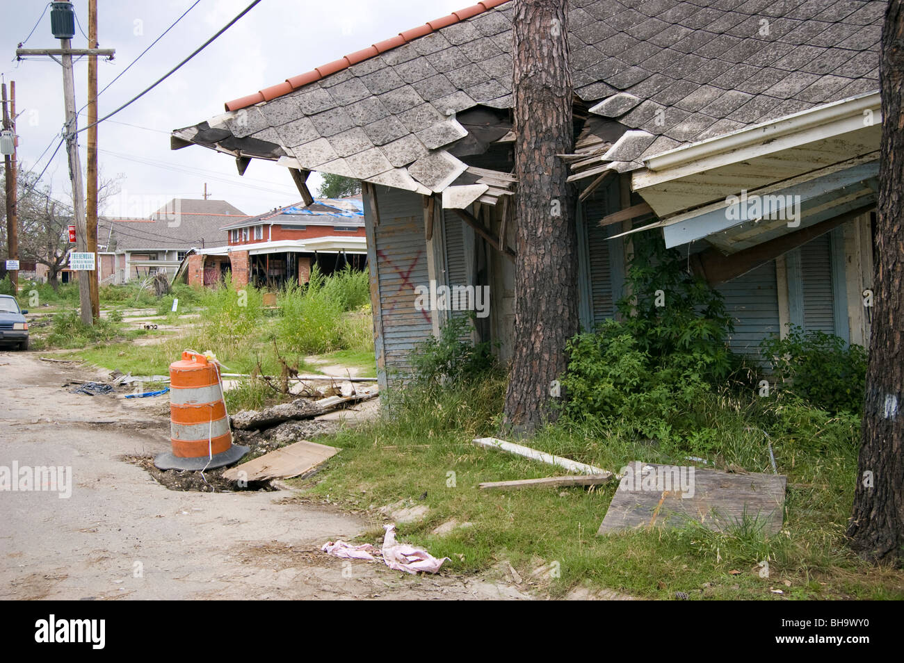 A home ran into a tree after the effects of Hurricane Katrina, in the ...