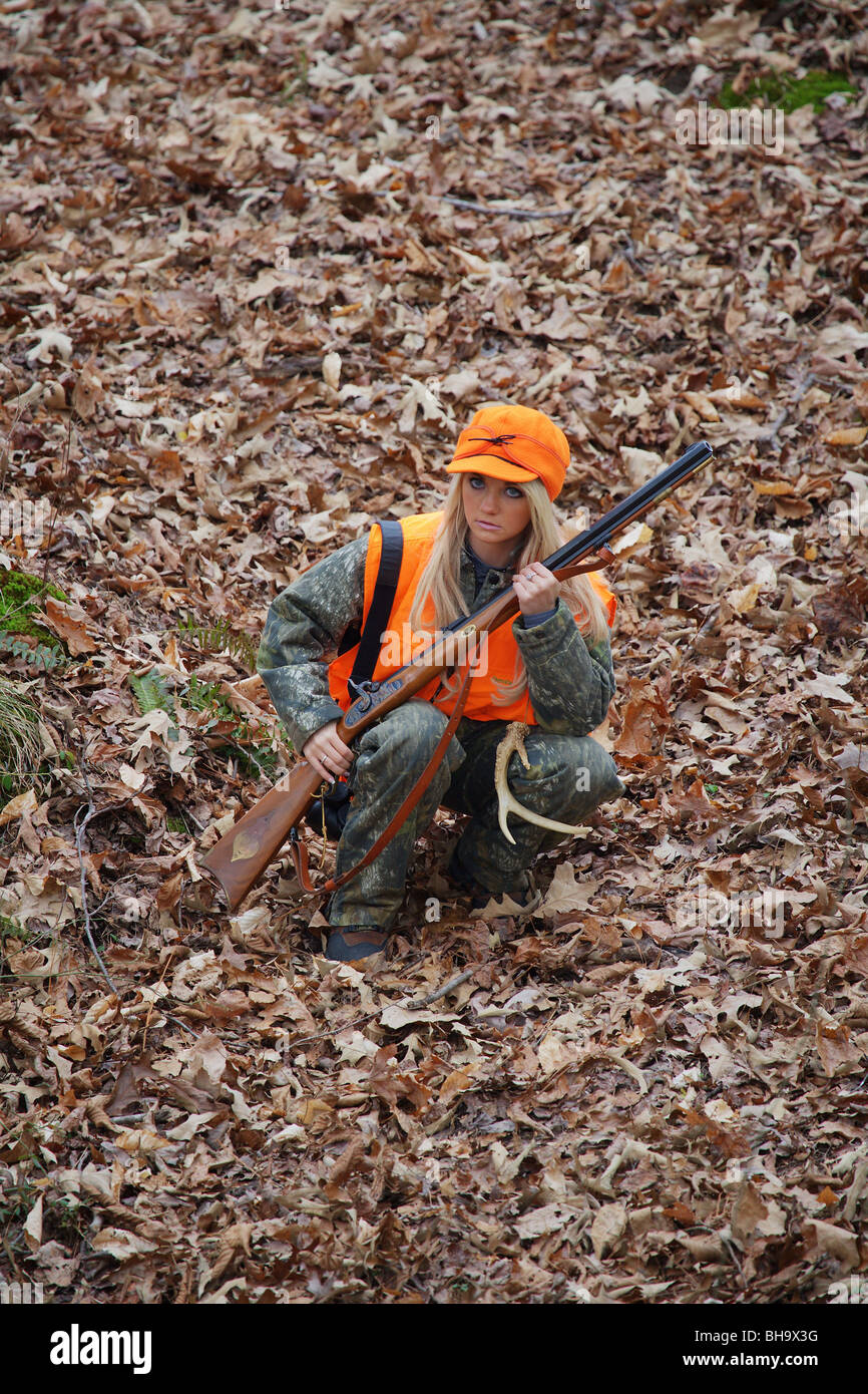 YOUNG WOMAN 21 Y.O. FEMALE HUNTER WALKING IN FOREST LOOKING FOR AND ...