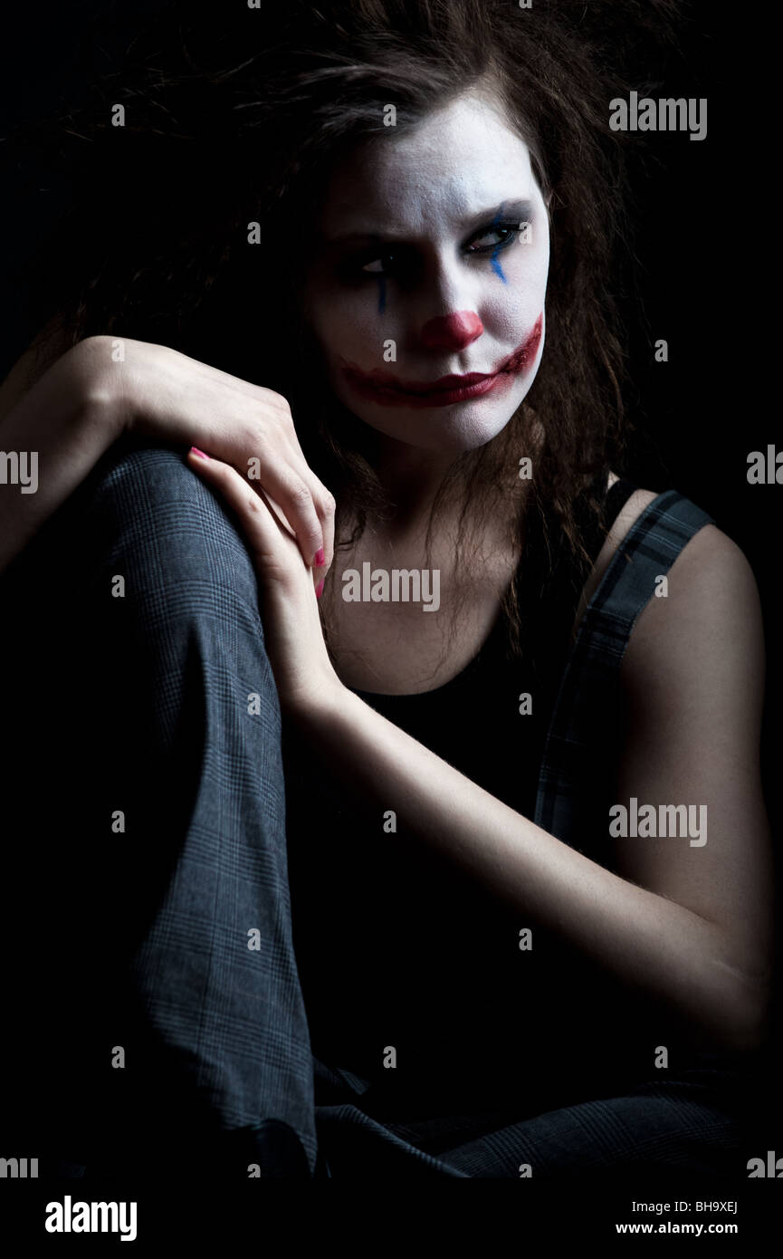 a scary and evil looking female clown Stock Photo - Alamy