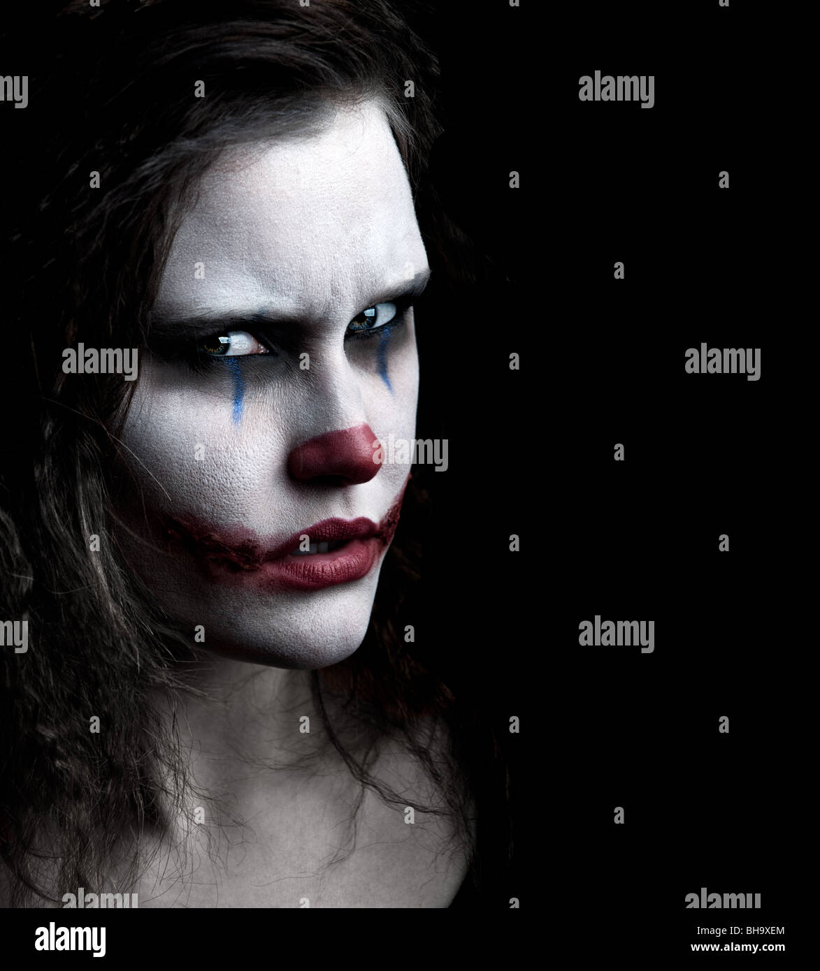 a scary and evil looking female clown Stock Photo - Alamy