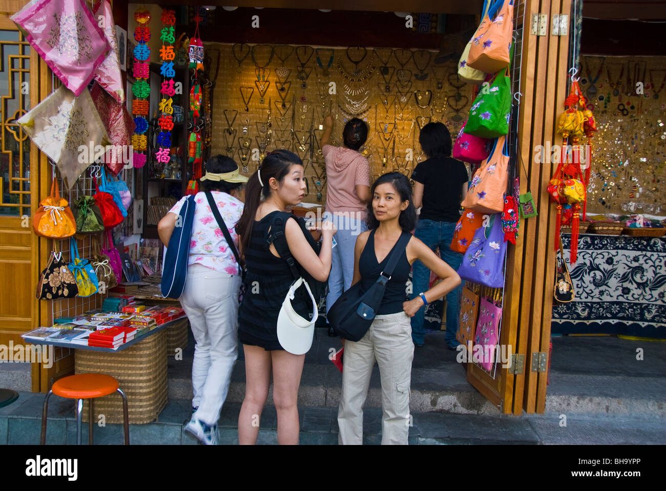 Beijing, CHINA- Asian Women Shopping in Small Fashion Store on Sidewalk ...