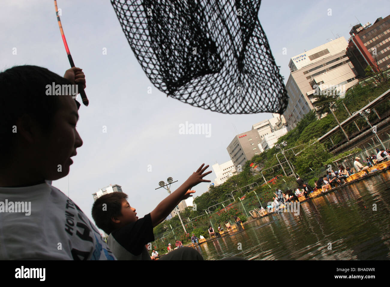 people fishing at the Ichigaya Fishing Centre, located in the outer ...