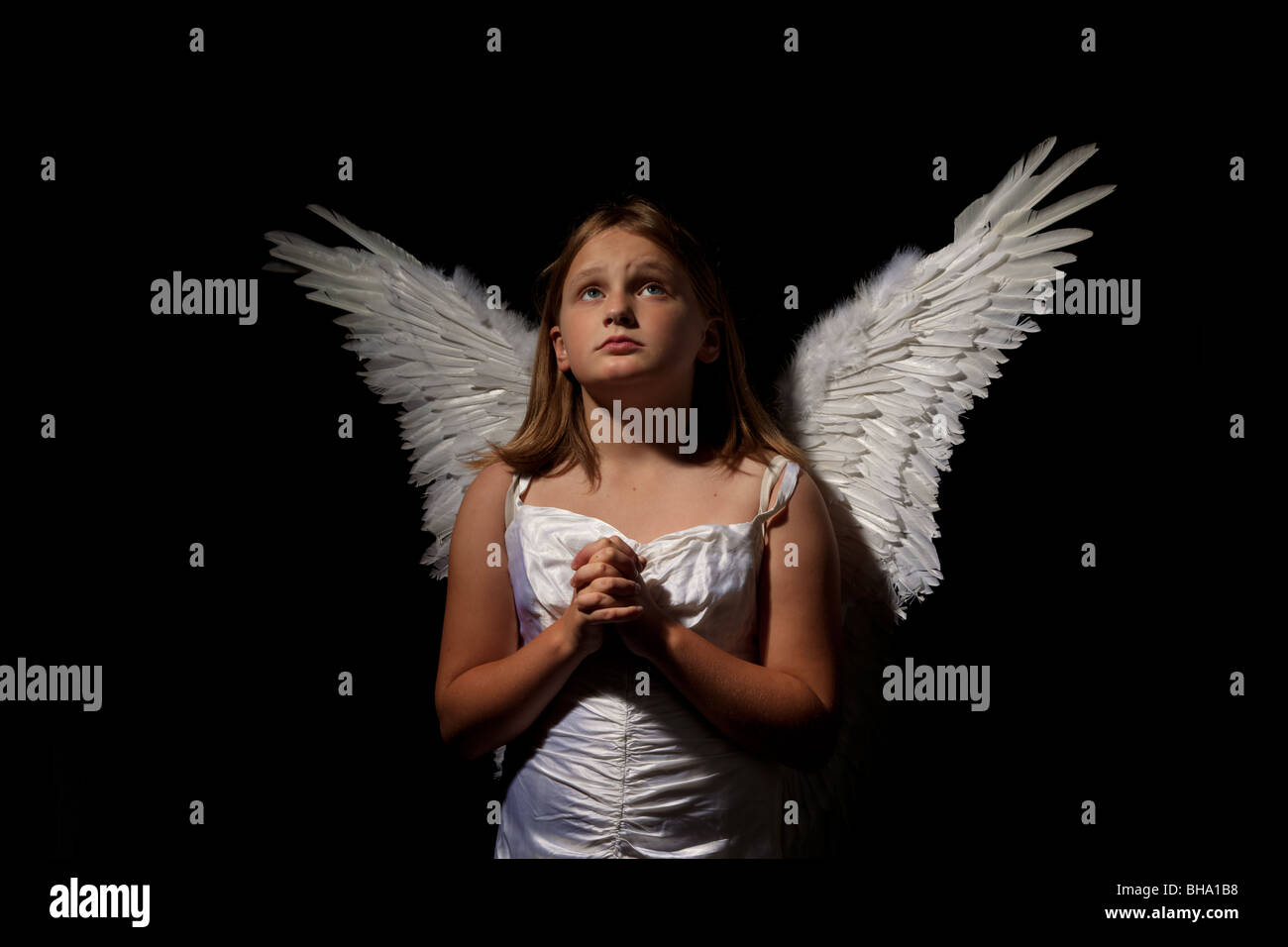pure and sweet angel in prayer at night Stock Photo - Alamy
