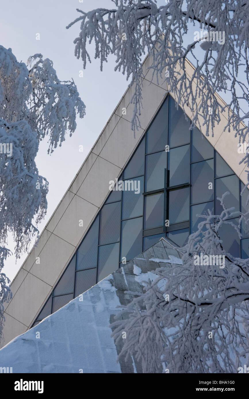 Modern church behind frozen icy snowy trees in Hyvinkää Finland Stock ...