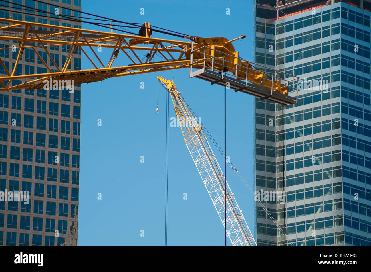 Construction cranes at work putting up high rise buildings Stock Photo ...
