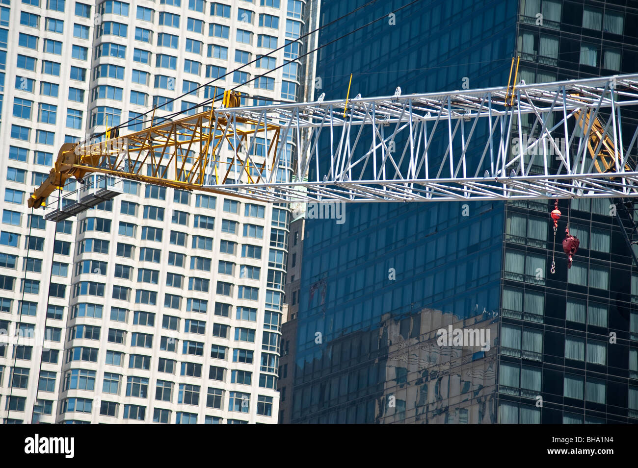 Construction cranes at work putting up high rise buildings at the new ...