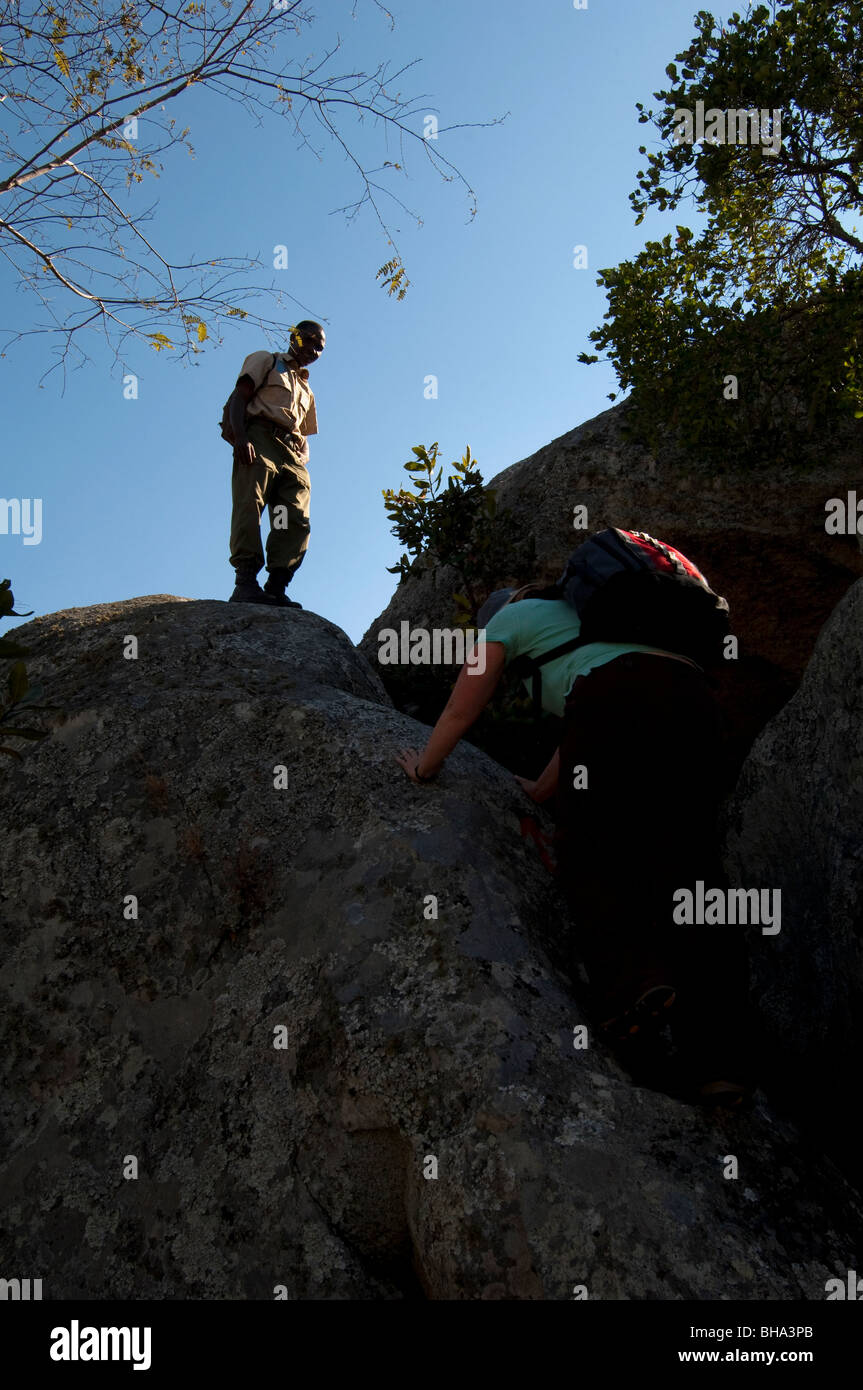 Tourists enjoy hiking through the rough terrain of the Umfurudzi Safari ...