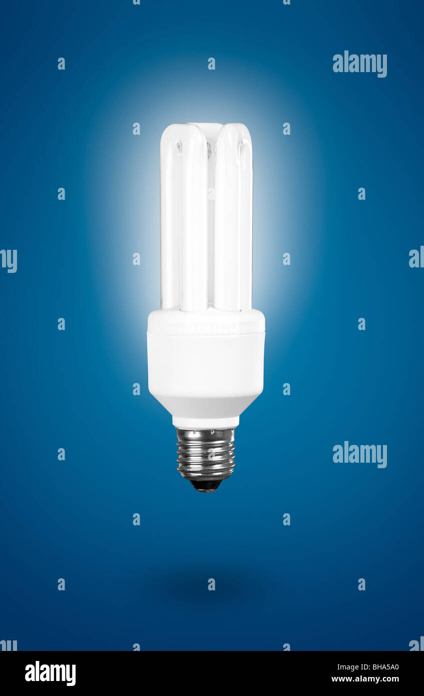 Fluorescent Light Bulb on a blue background – energy concept Stock ...