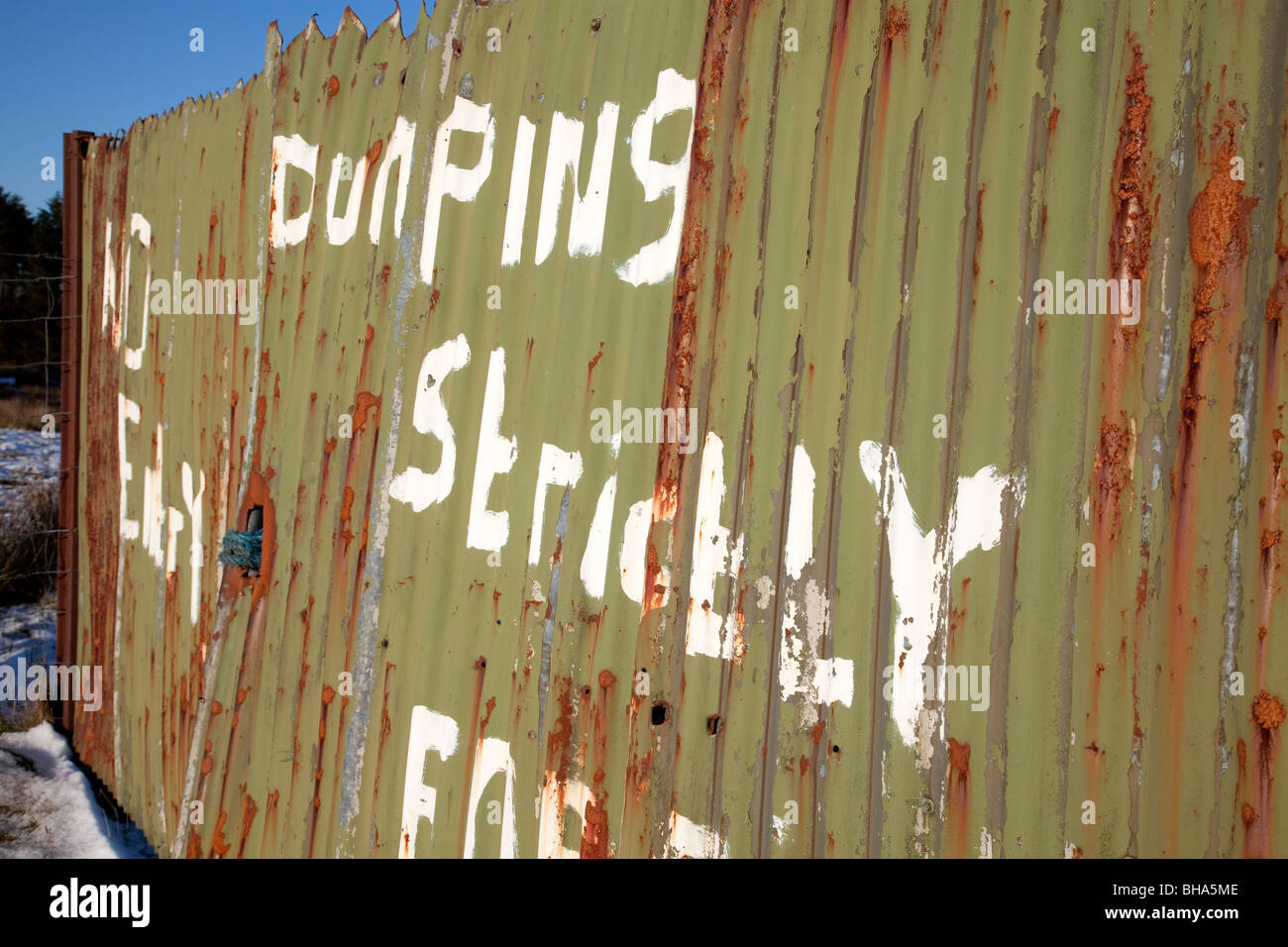 Rusty corrugated metal fence with no entry sign Stock Photo - Alamy
