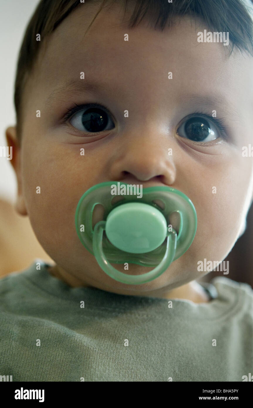 Baby boy with pacifier Stock Photo - Alamy