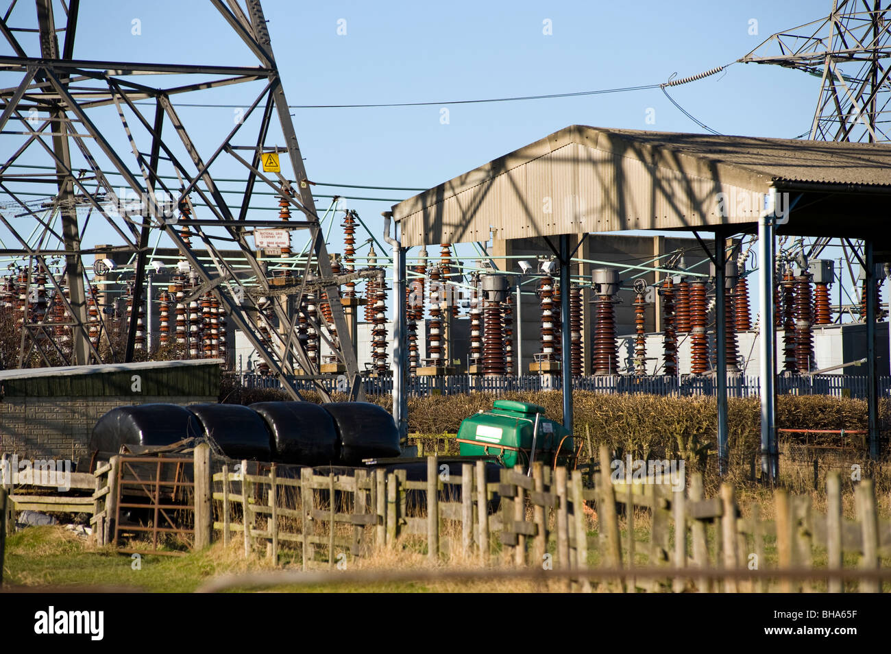 Electric sub station with farm buildings Stock Photo - Alamy