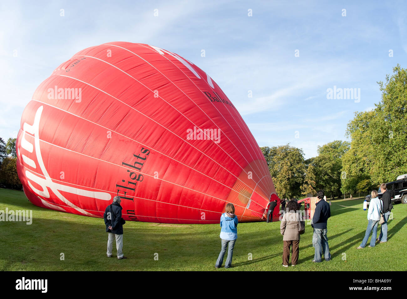 People looking at hot air balloon inflation set up at the Victoria Park ...