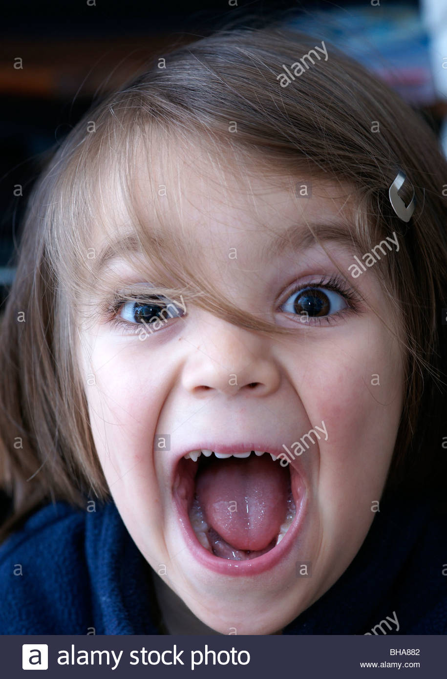 Happy child SHOUTING MOUTH OPEN happy children portraits Stock Photo ...