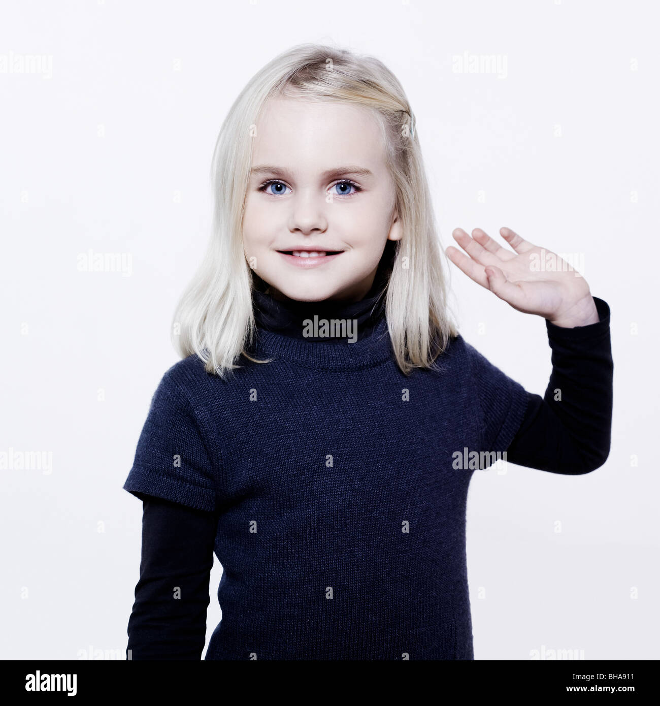 studio portrait of a caucasian cute litle girl saluting Stock Photo - Alamy