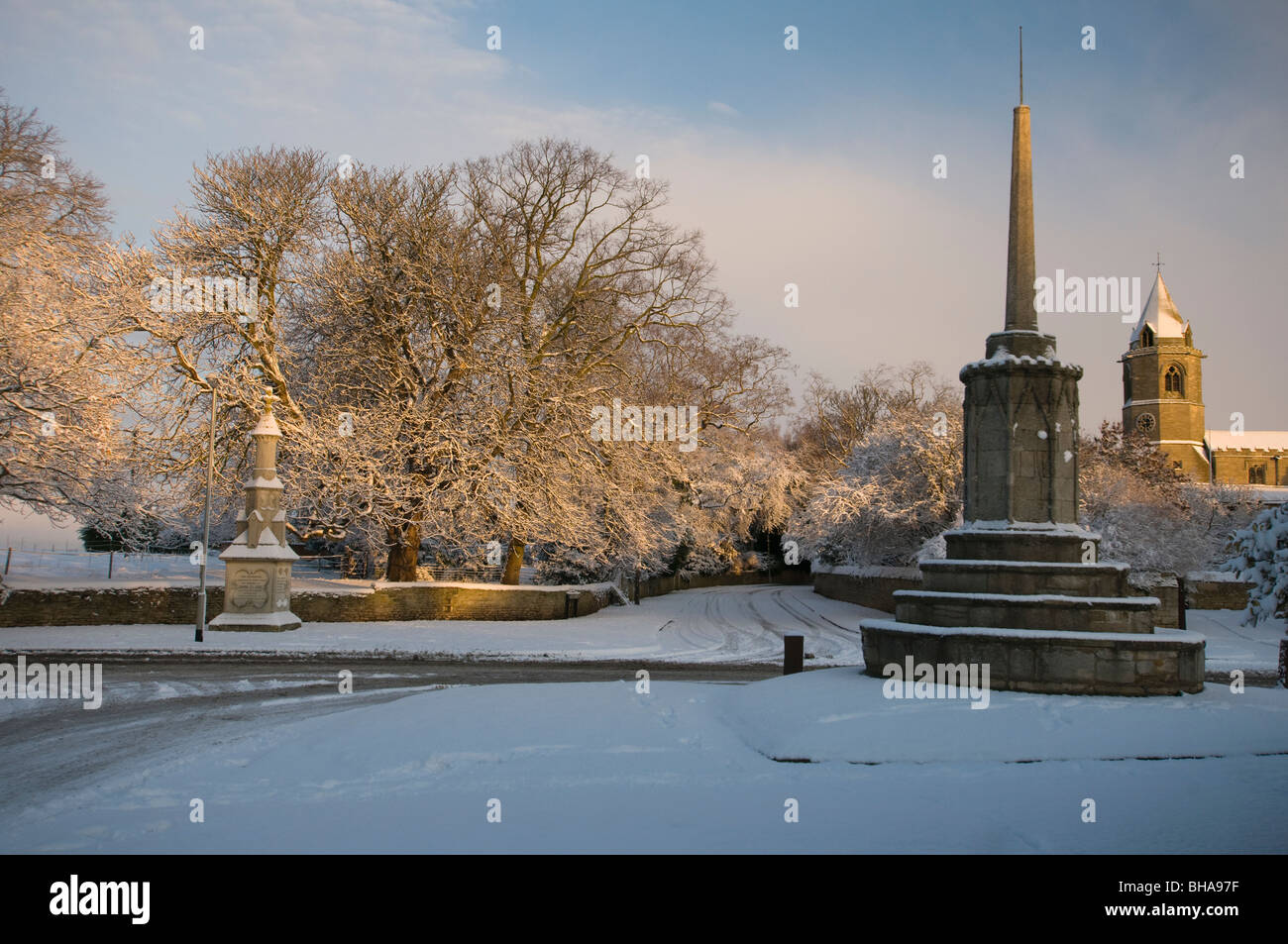 The Buttercross and St Botolph's church covered in snow on a winters ...